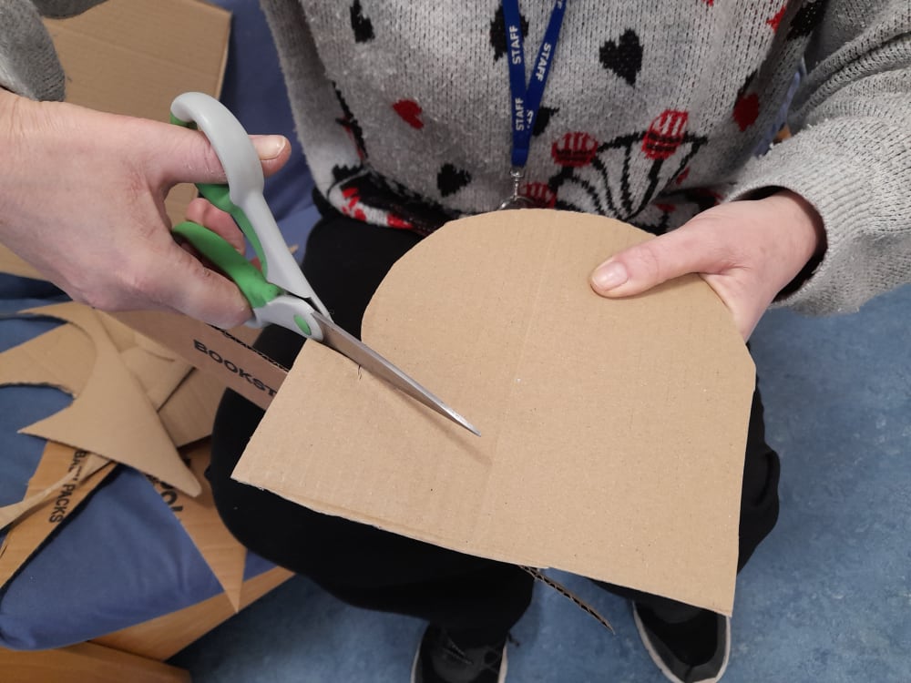 Sewing cardboard shapes | The Froebel Partnership