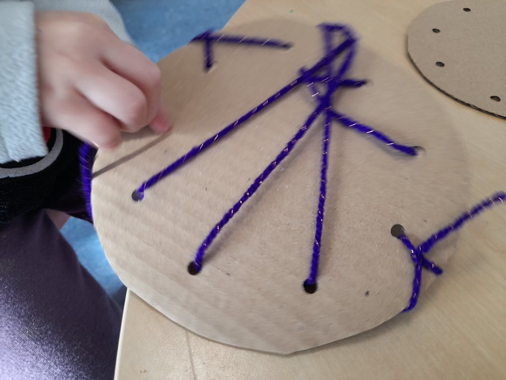 Sewing cardboard shapes | The Froebel Partnership